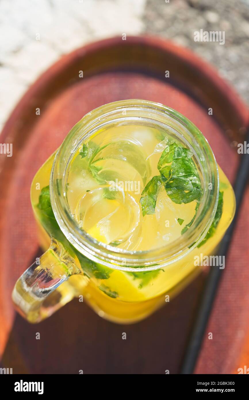 Ice cold fruit and mint tea with ice Stock Photo - Alamy