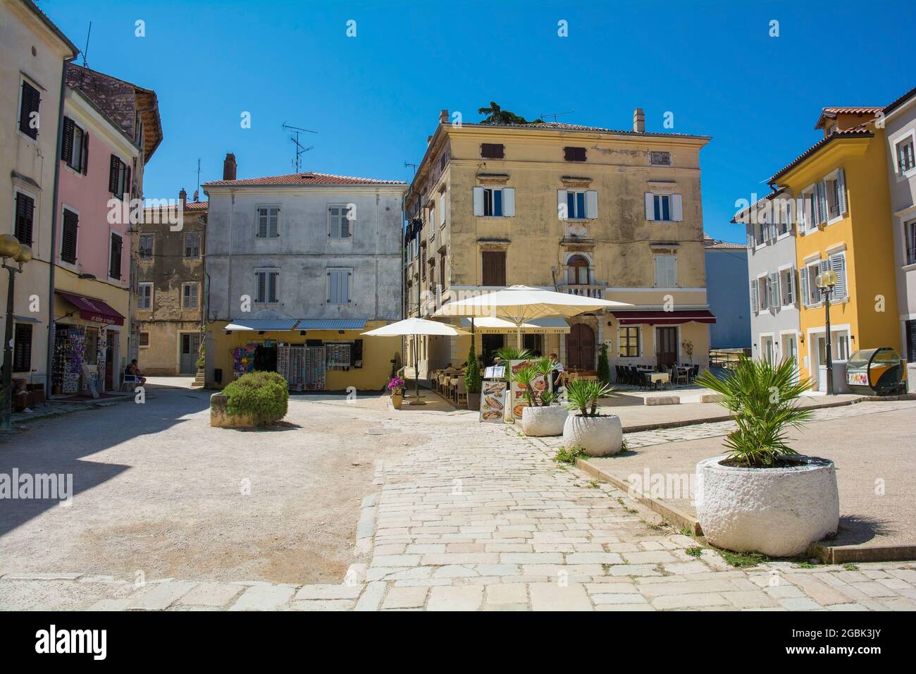 Porec, Croatia- July 10th 2021. A pedestrianised square in the centre ...