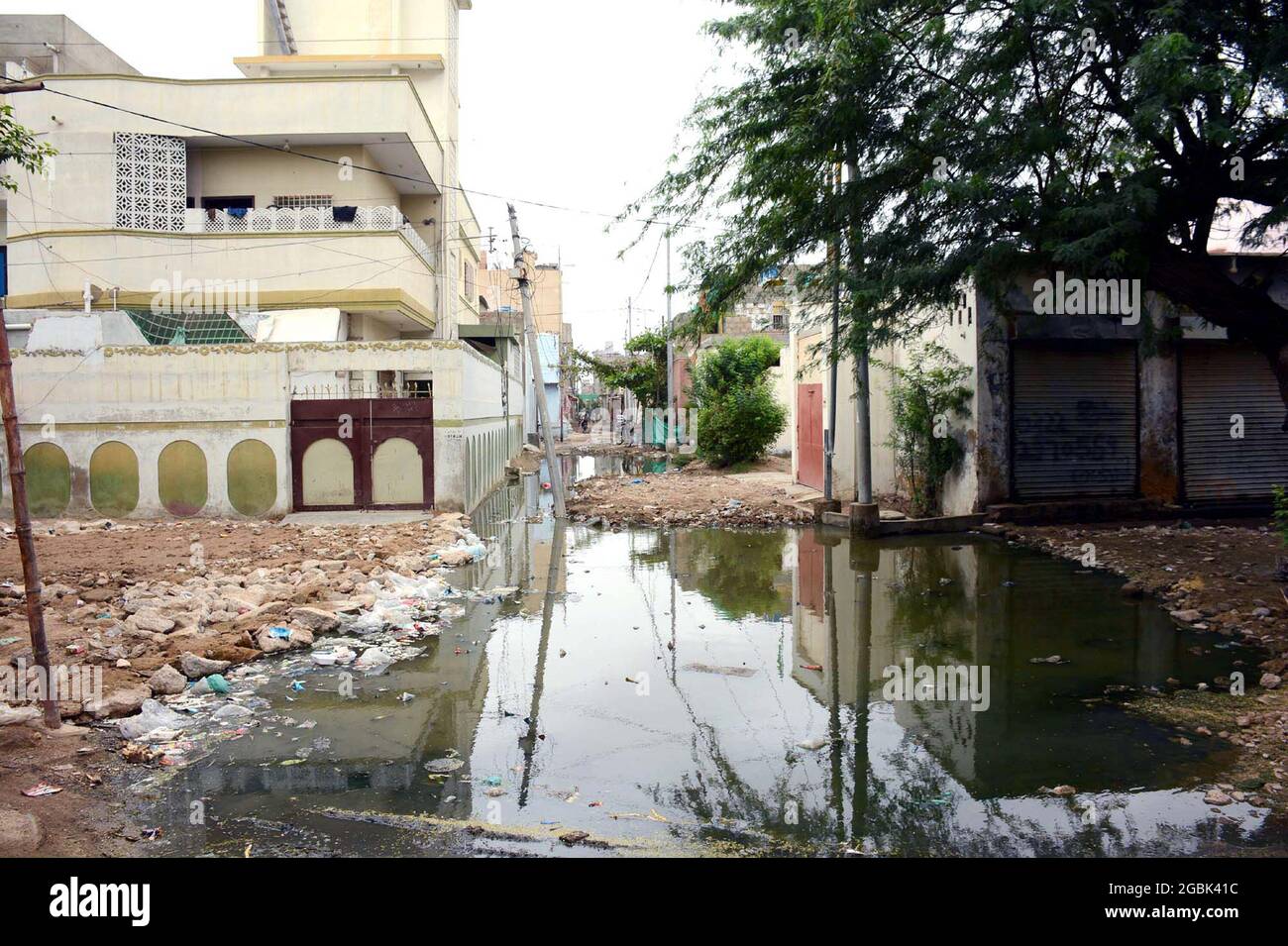 Hectic street full of garbage and sewerage water, causing unhygienic ...