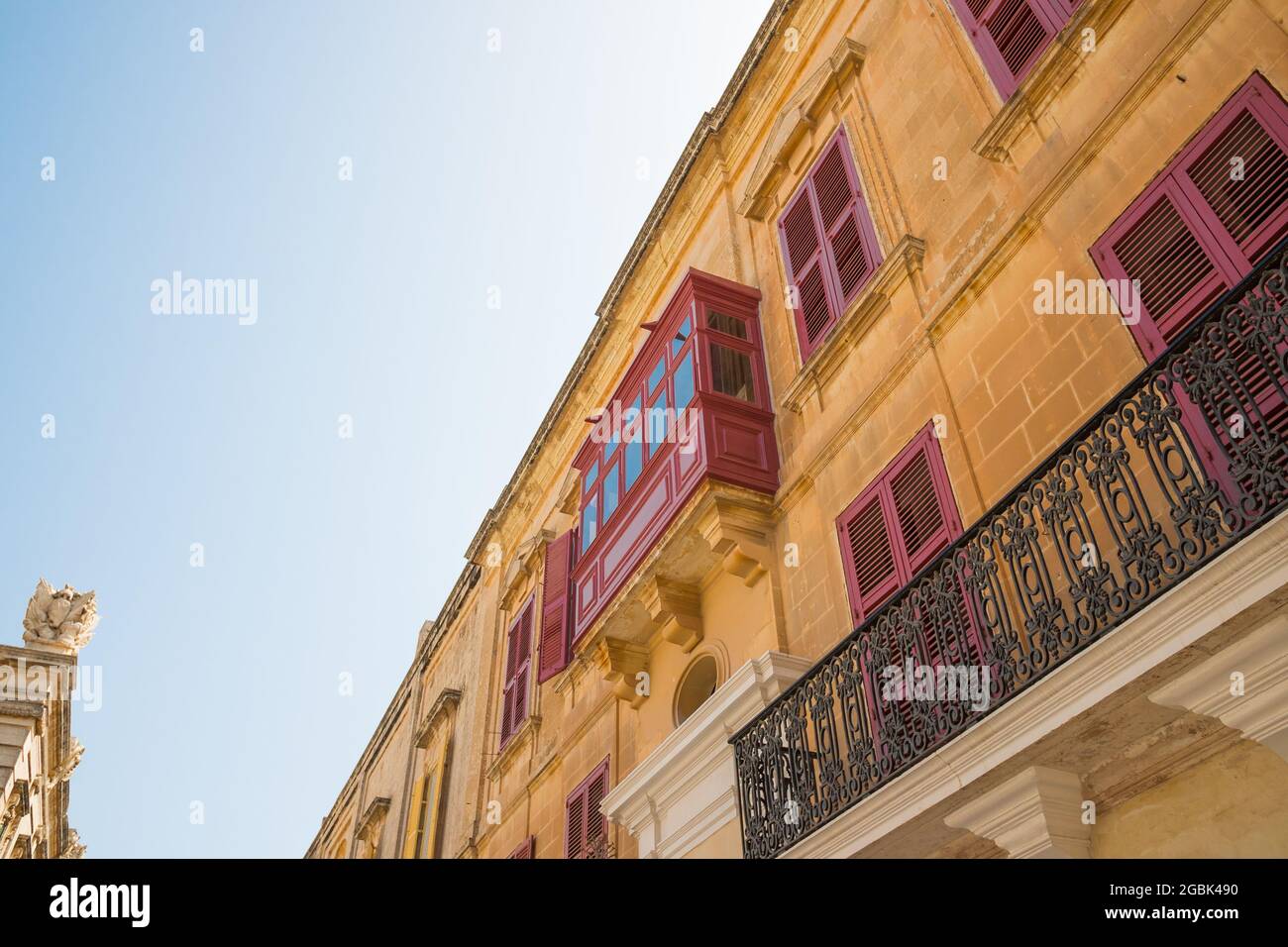 Low-angle shot of aa building with typical bow windows in Malta Stock ...