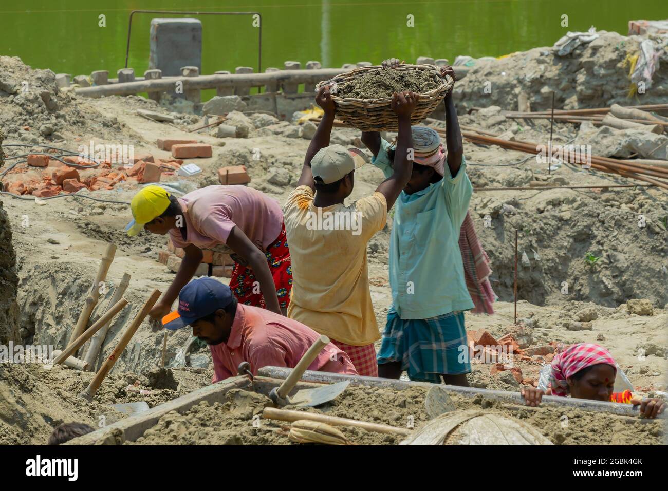 Howrah, West Bengal, India - 7th May 2017 : Indian male workers digging ...