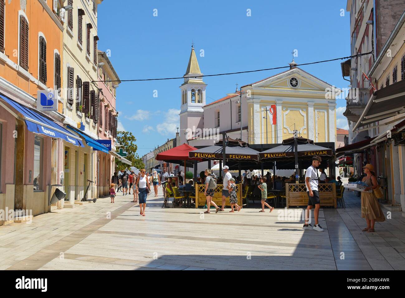 Porec, Croatia- July 10th 2021. A street busy with shops, banks ...