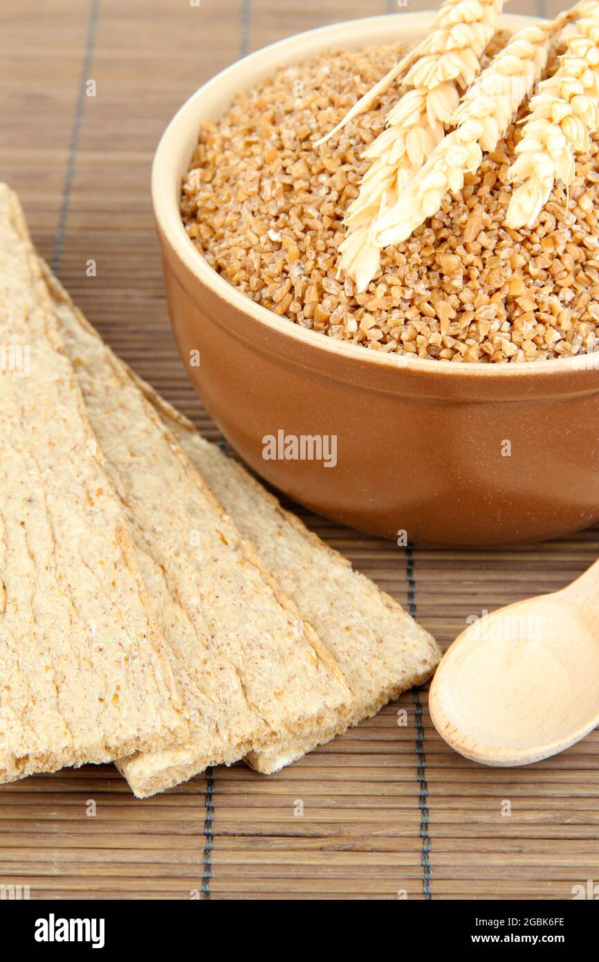 Brown bowl full of wheat bran Stock Photo - Alamy