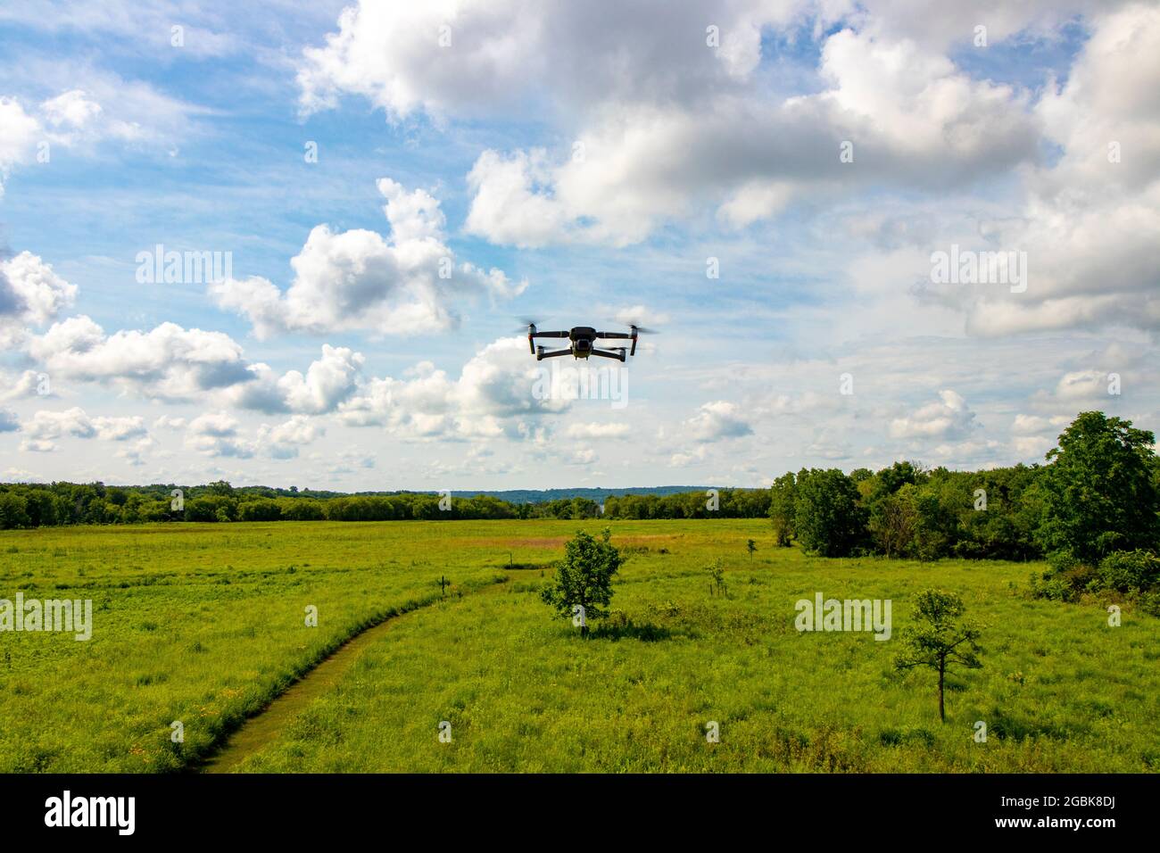 Drone flying over grass hi-res stock photography and images - Alamy