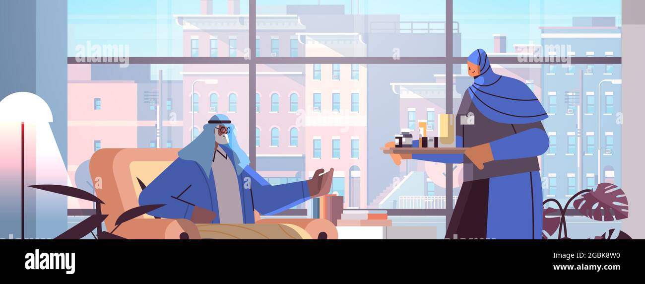 friendly arab nurse or volunteer bringing pills to arabic elderly man ...