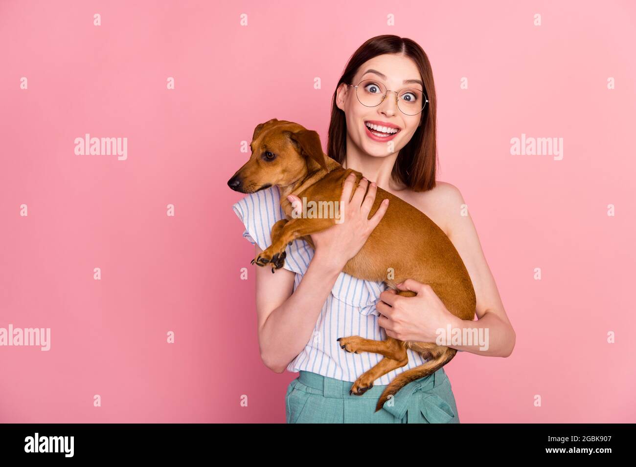 Photo of impressed brunette young lady hug dog wear eyewear white top ...