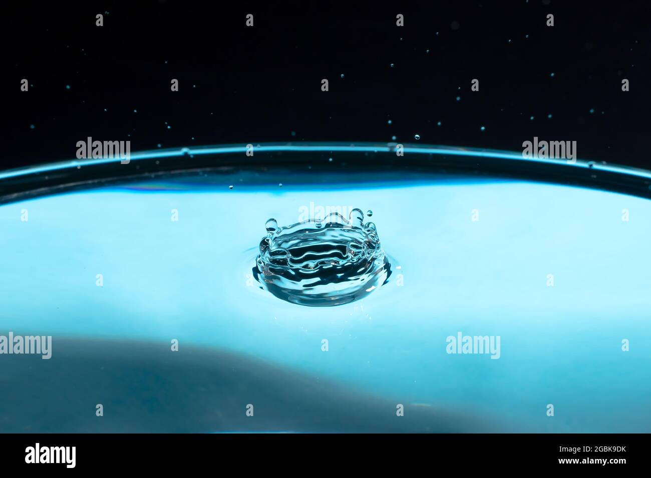 Water splash in crown shape and falling drop. Splash of the falling ...