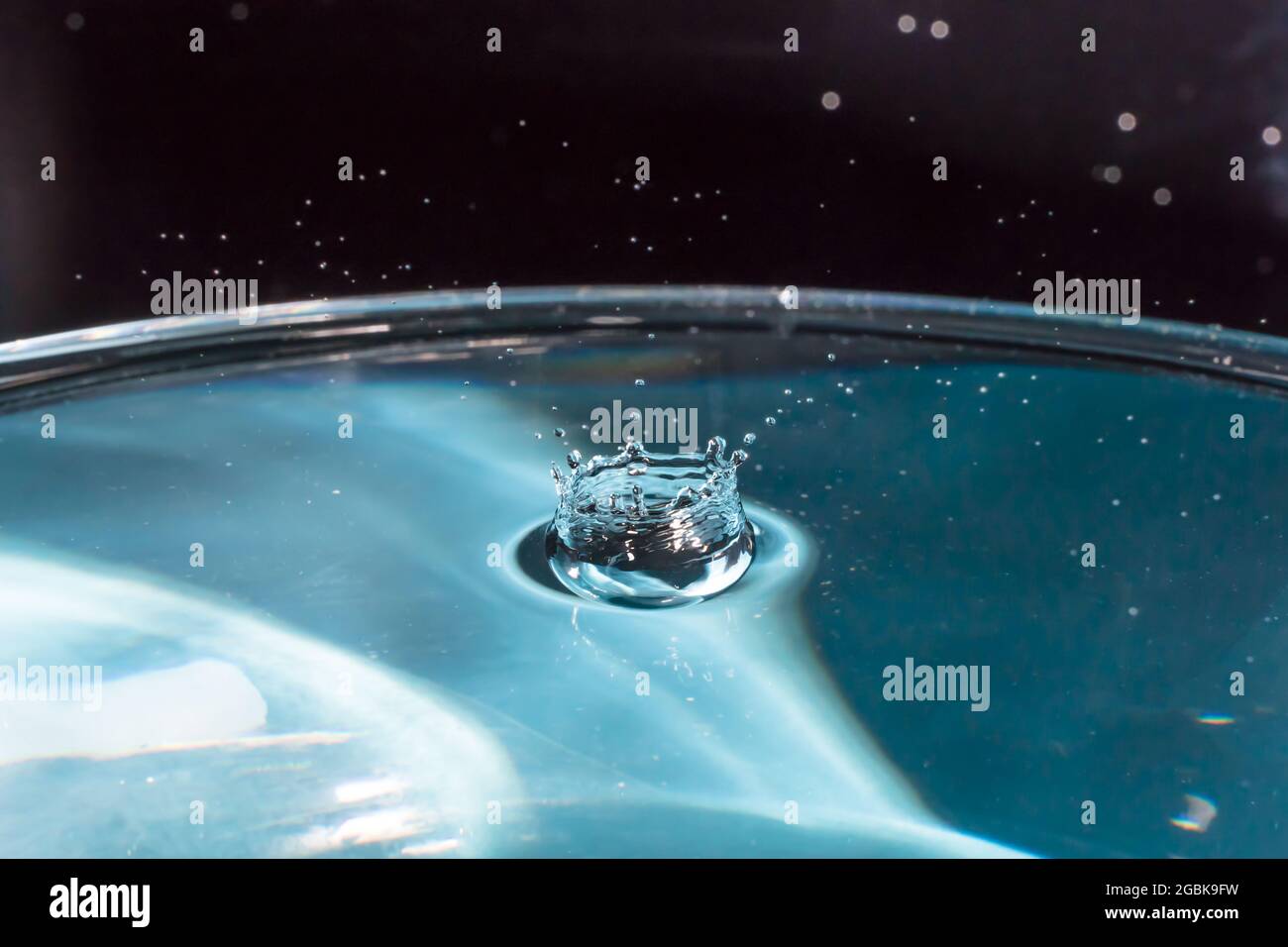 Water splash in crown shape and falling drop. Splash of the falling ...