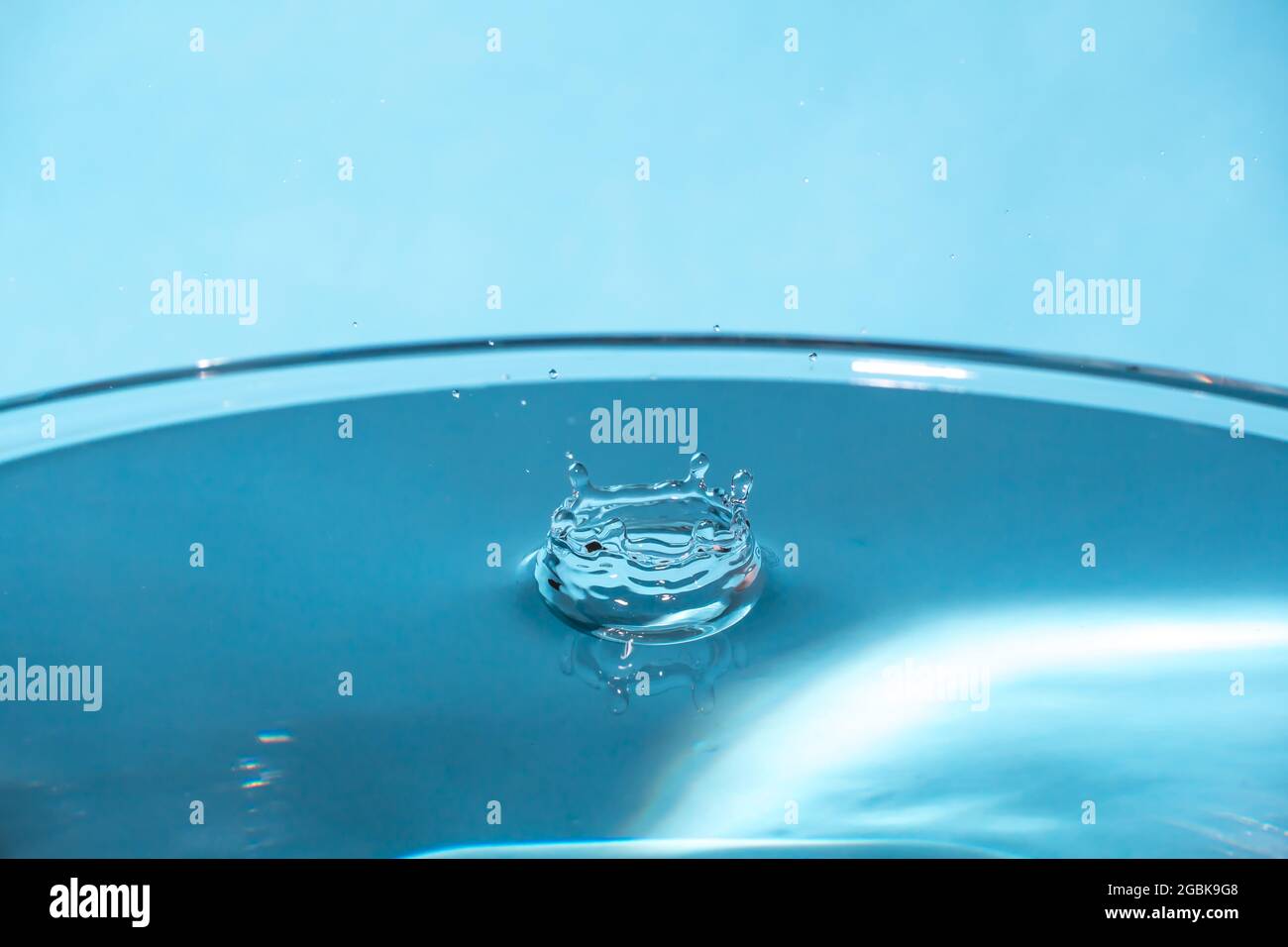 Water splash in crown shape and falling drop. Splash of the falling ...