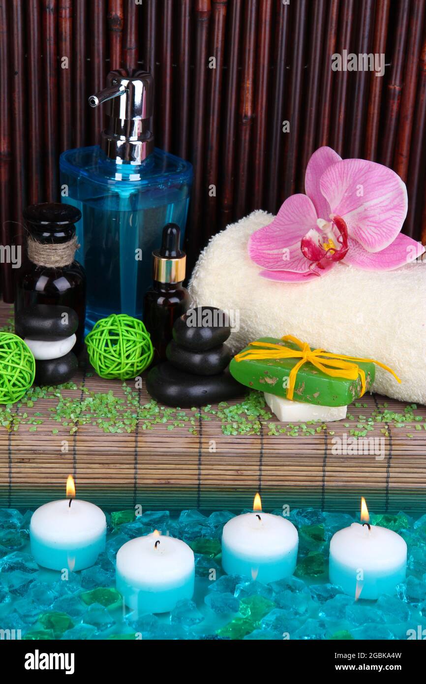 Beautiful spa setting near pool on bamboo background Stock Photo - Alamy