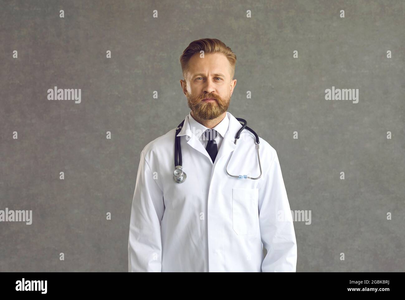 Half-length studio portrait of thoughtful serious confident caucasian ...