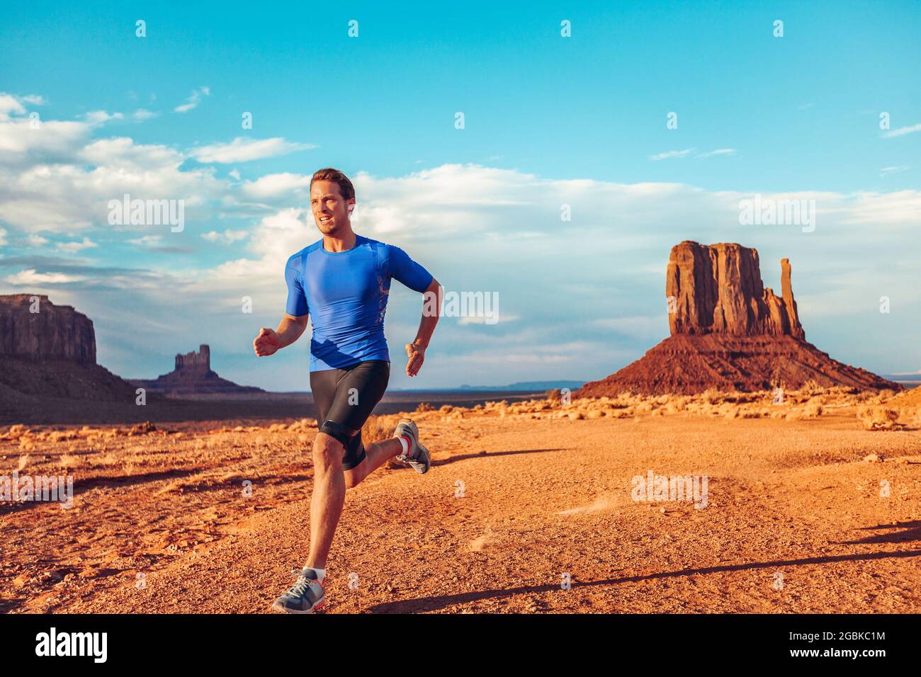 Fitness athlete runner man sprinting ultra running across desert ...