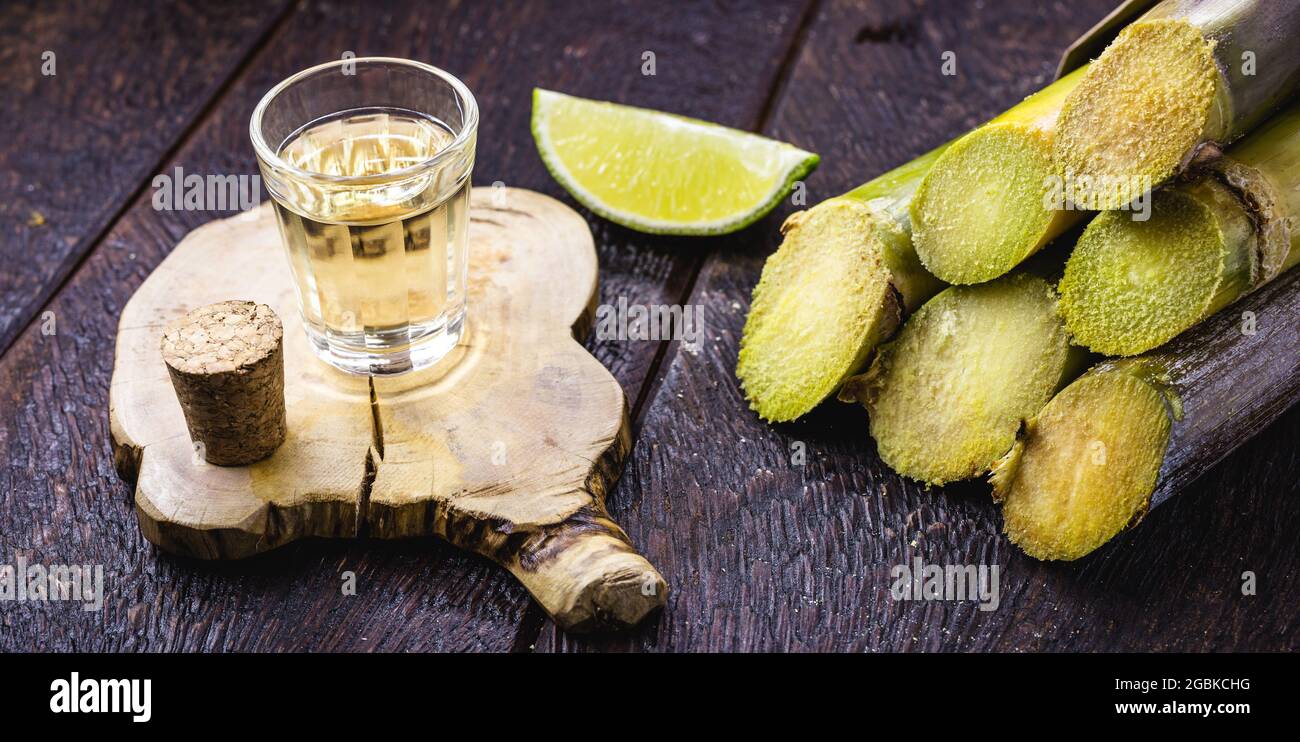 glass of alcoholic drink with lemon, distilled from sugar cane, called ...