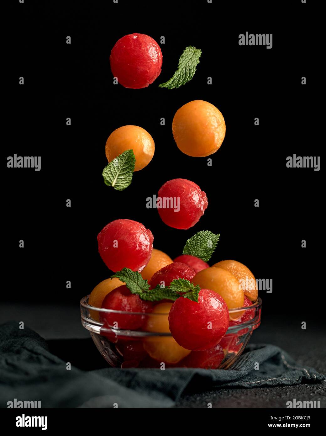 Creative concept with falling food on black backdrop Stock Photo - Alamy
