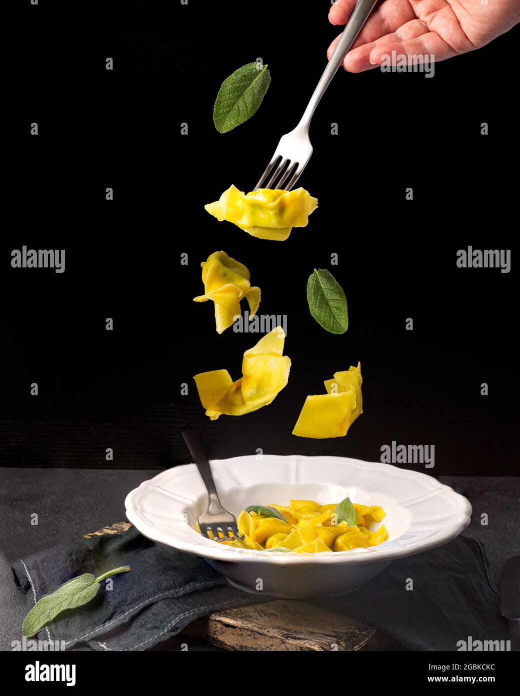 Creative concept with falling food on black backdrop Stock Photo - Alamy