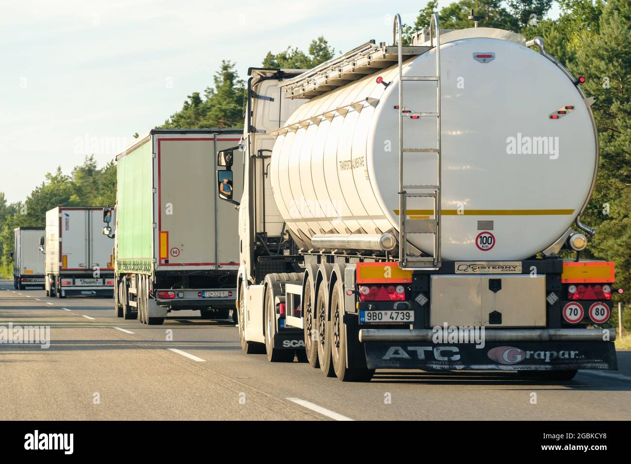 Tank truck and lorry trucks driving on the road, July 2021, Zagreb ...