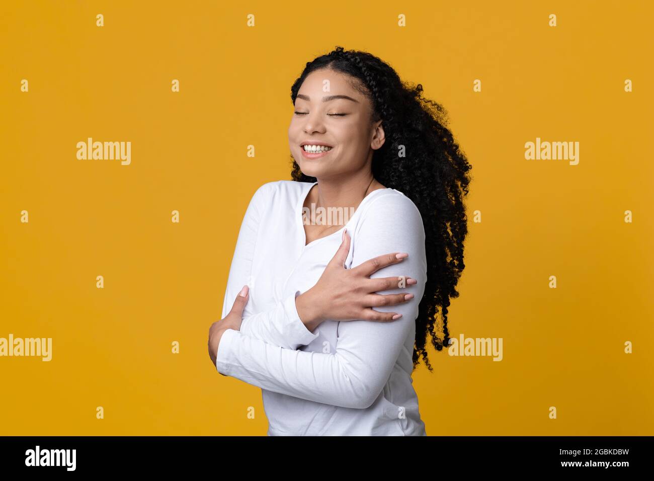 Love Yourself Concept. Happy Young African American Lady Embracing ...