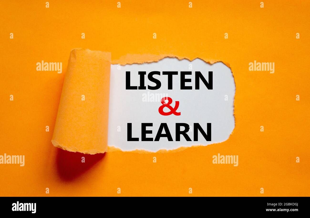 Listen and learn symbol. Words 'Listen and learn' appearing behind torn ...