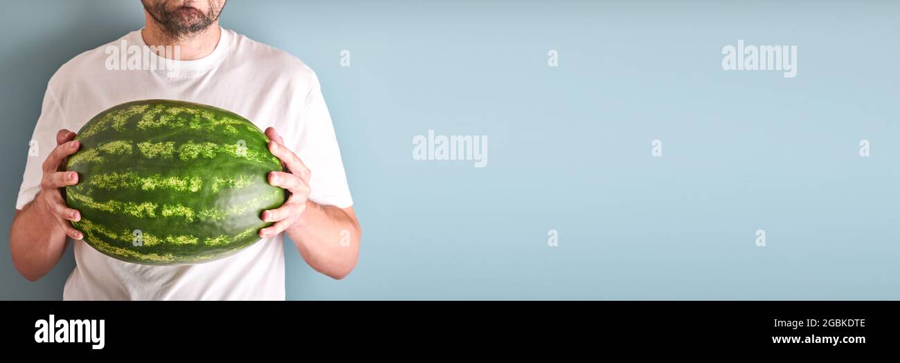 Young man keep whole hi-res stock photography and images - Alamy