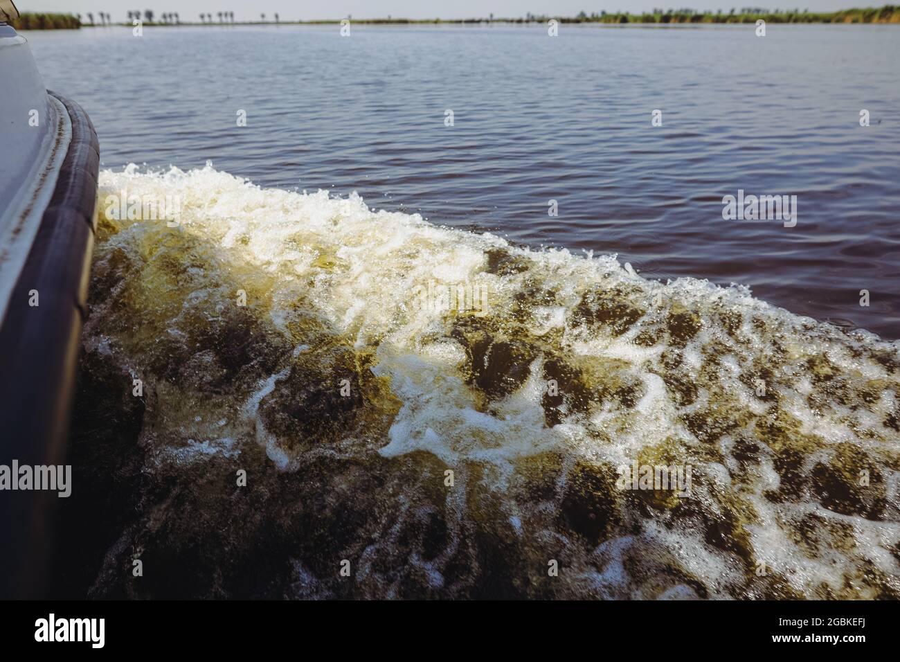 Details with the surf created by a moving small boat on a lake Stock ...