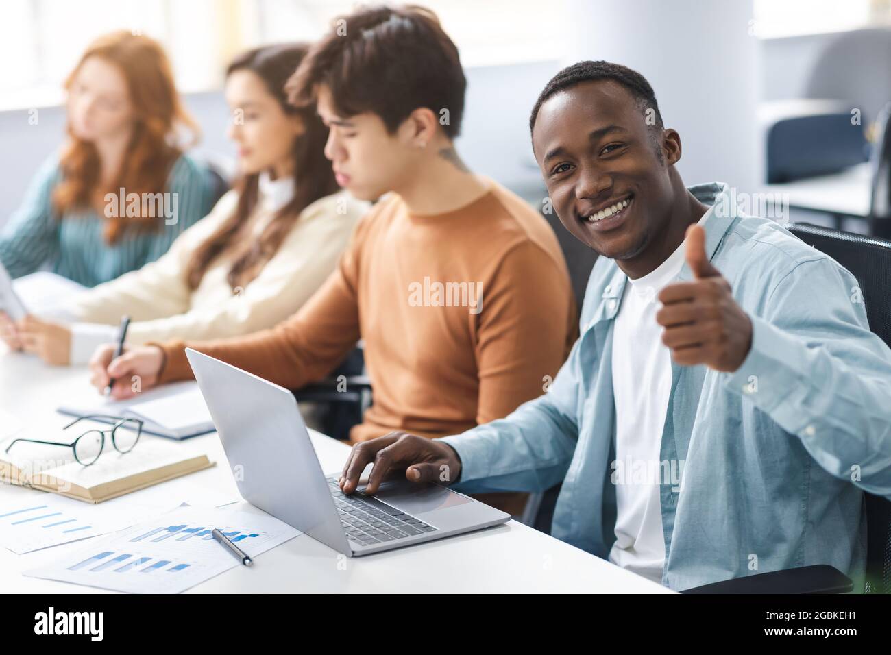 Multiethnic group using laptops hi-res stock photography and images - Alamy