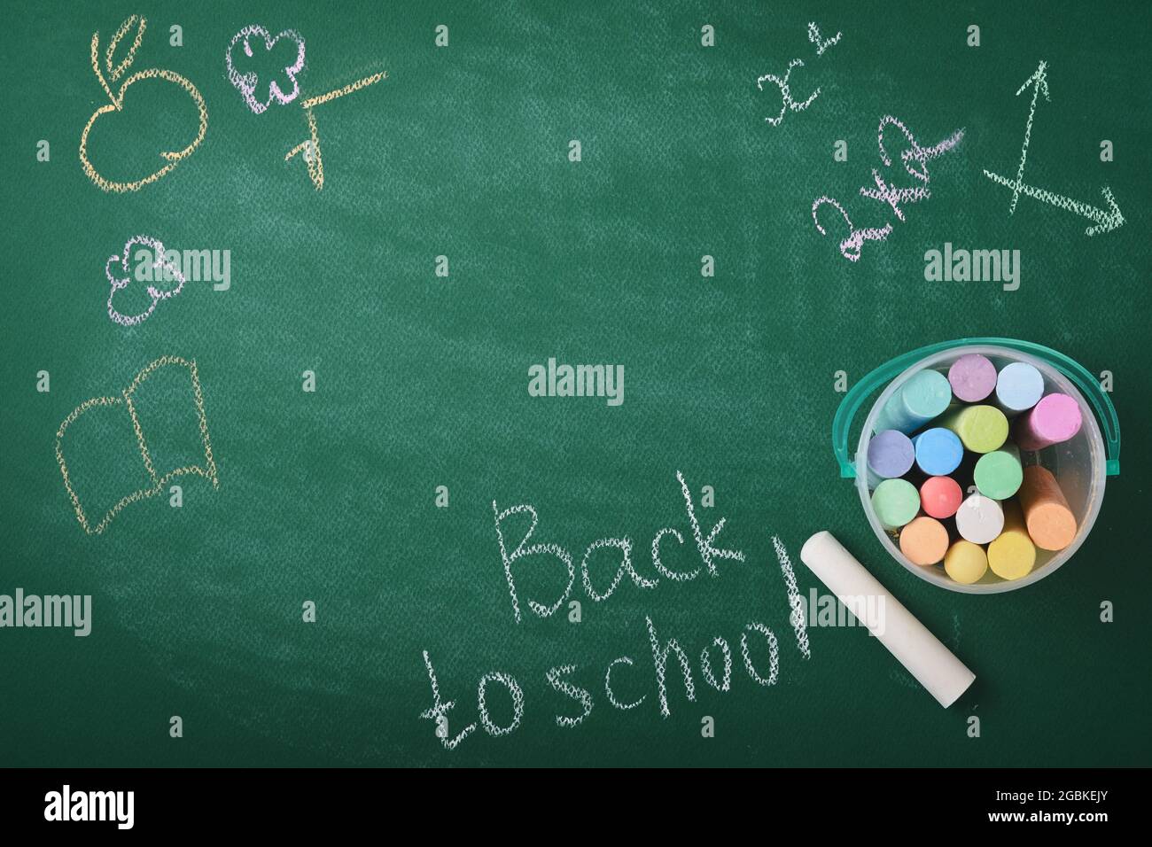 Color chalk pencil on green school board. Concept back to school. Mock ...