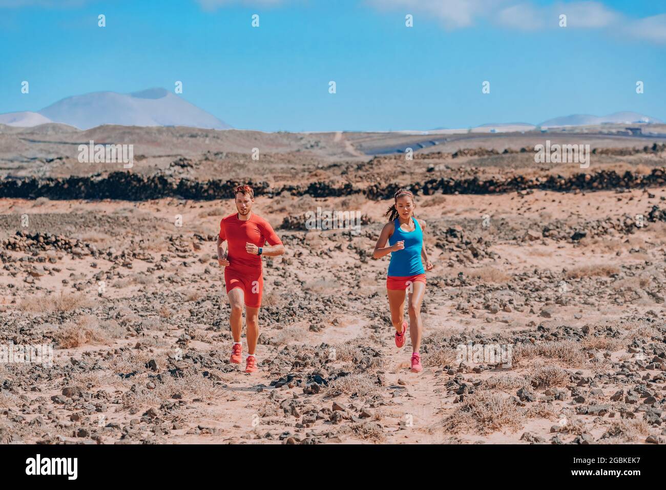 Sport athletes runners trail running training endurance in desert ...