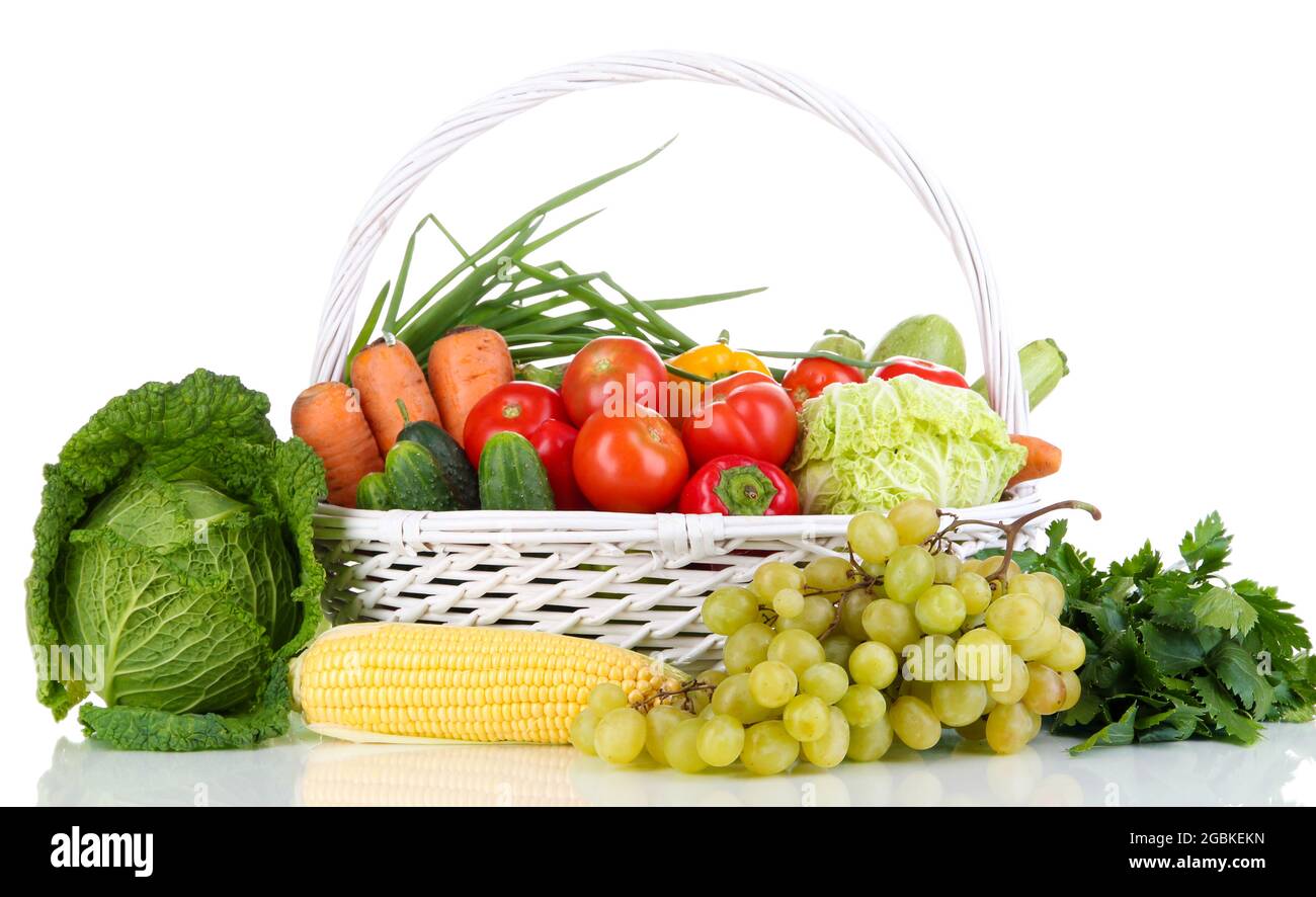 Composition with vegetables and fruits in wicker basket isolated on ...