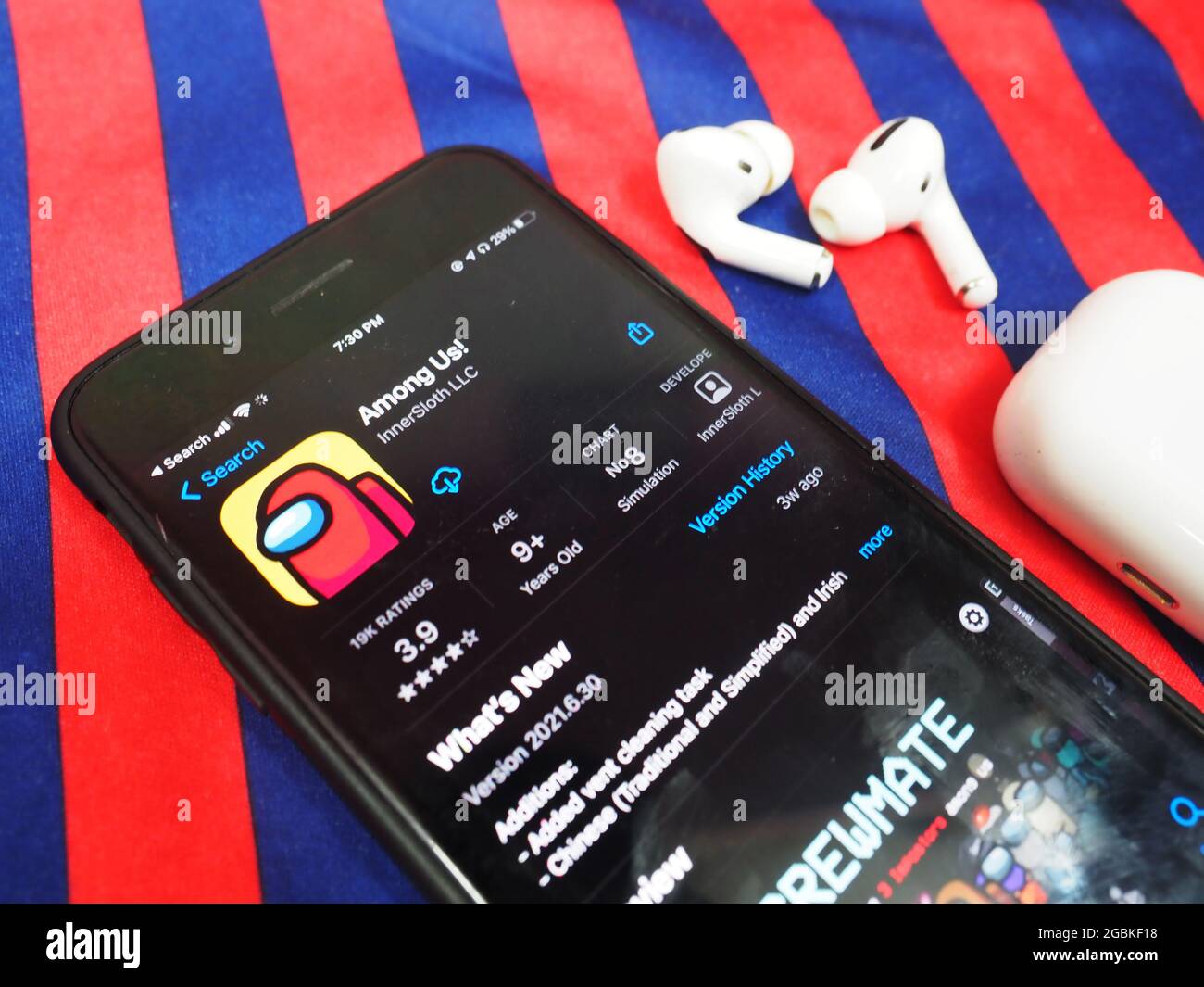 KOLKATA, INDIA - Aug 02, 2021: cell phone and headphone on colorful ...