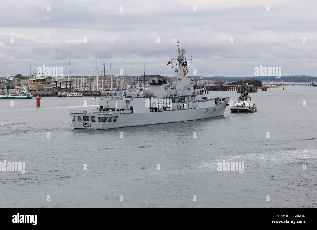 Tugs escort the Pakistan Navy Ship PNS ZULFIQUAR into the Naval Base ...