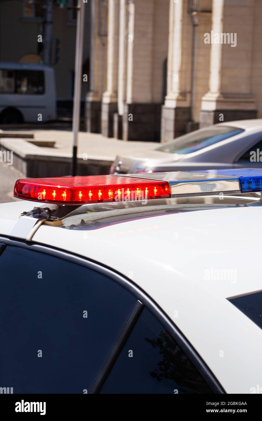 a police car with red and blue sirens at the checkpoint. Police work ...