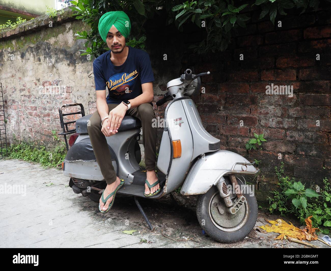 KOLKATA, INDIA - Jul 26, 2021: Indian Sikh teen boy wears an green ...