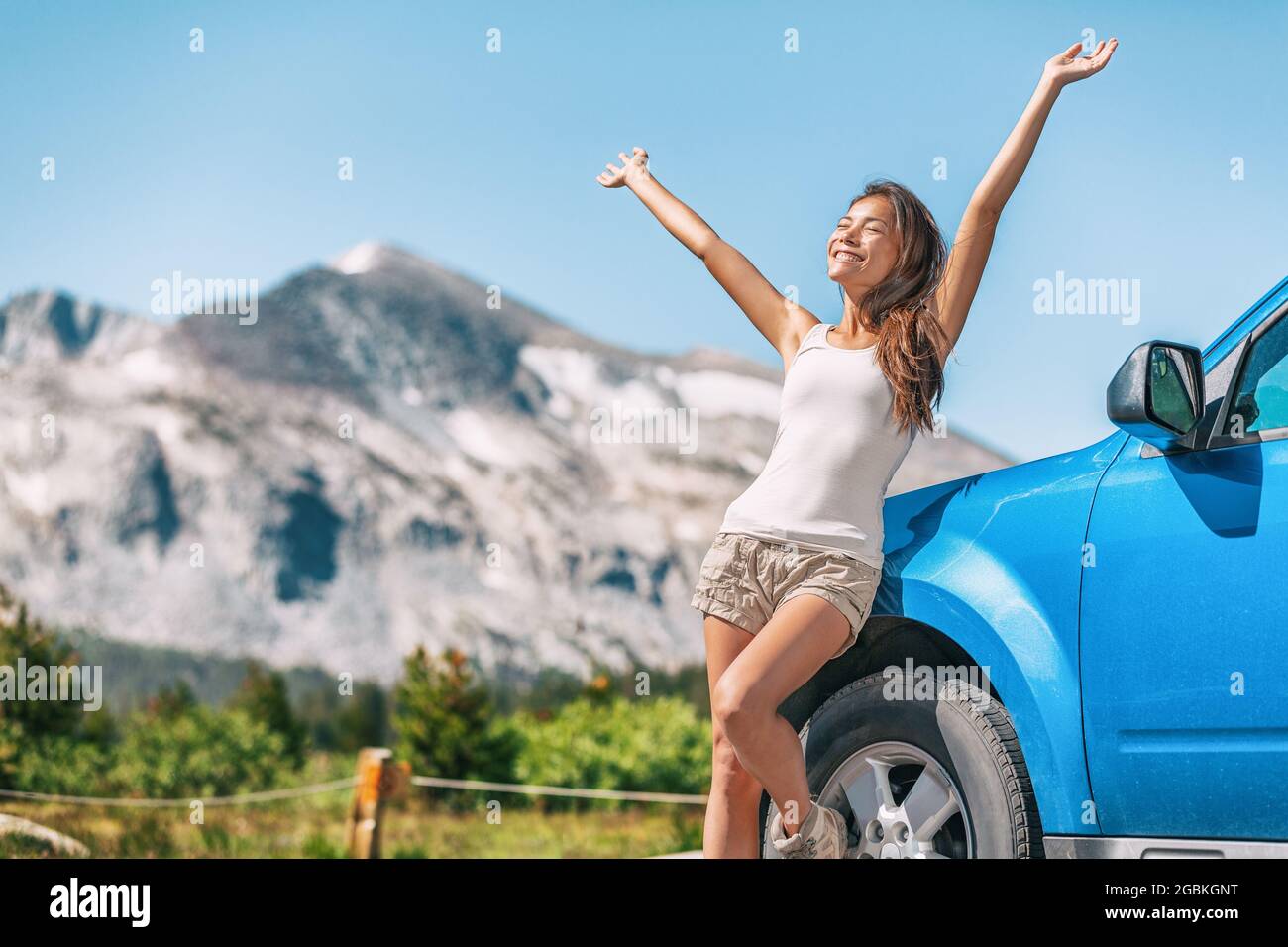 Happy road trip tourist girl enjoying driving sport car on summer ...