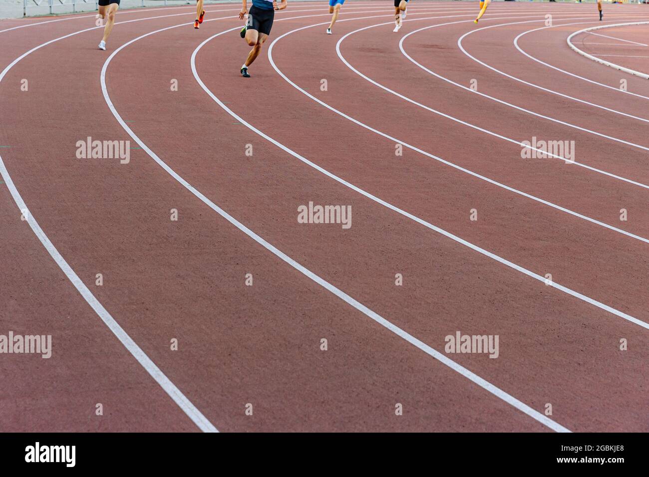 legs male runners athletes run on track race Stock Photo - Alamy