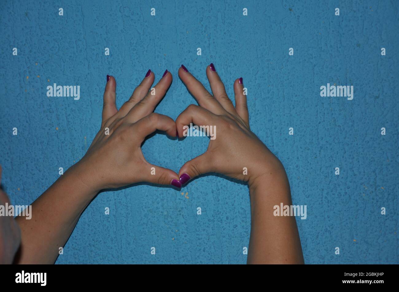Hands shaping heart. Hands in the same of a heart Stock Photo - Alamy