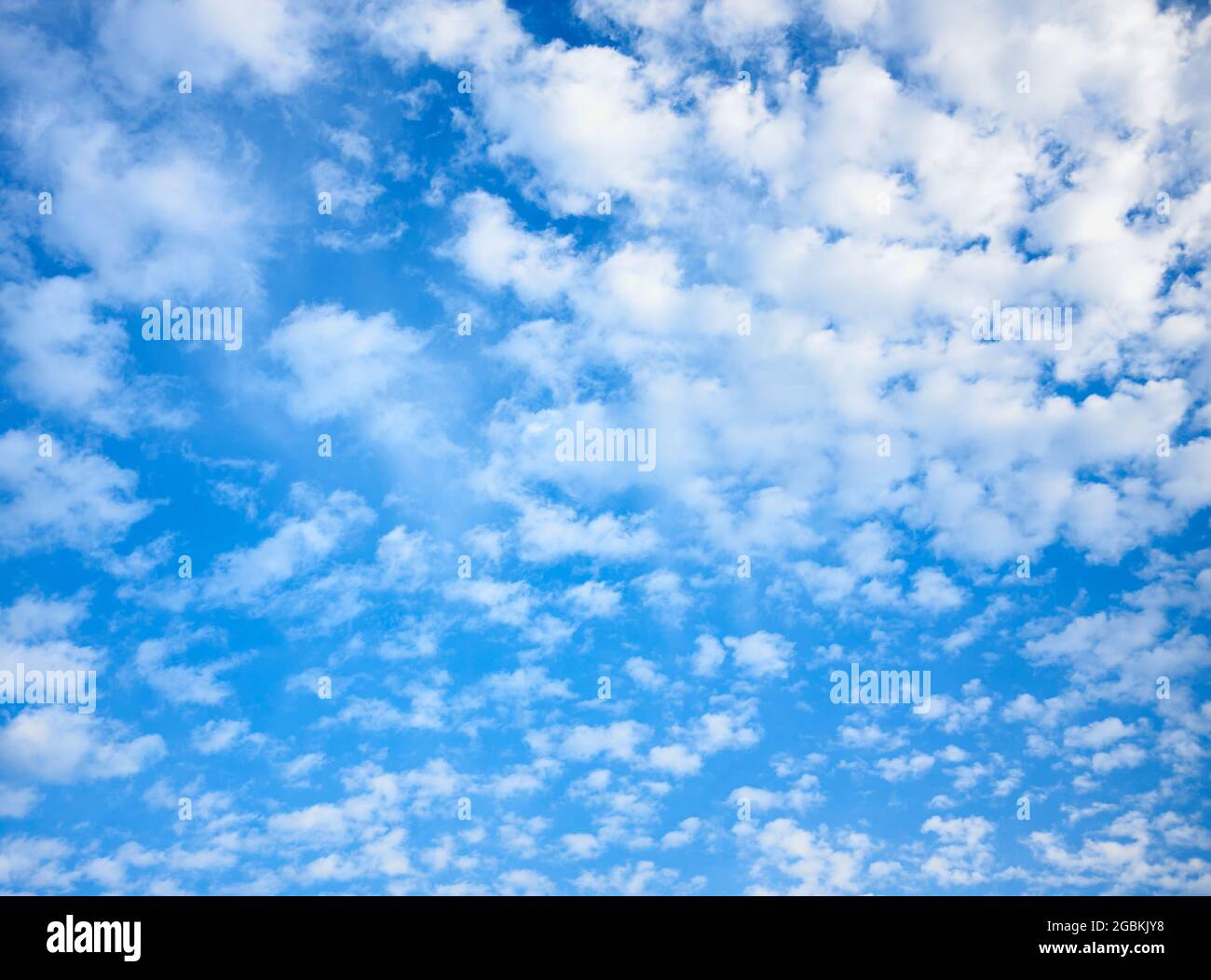 Blue celestial background with white fleecy clouds Stock Photo - Alamy
