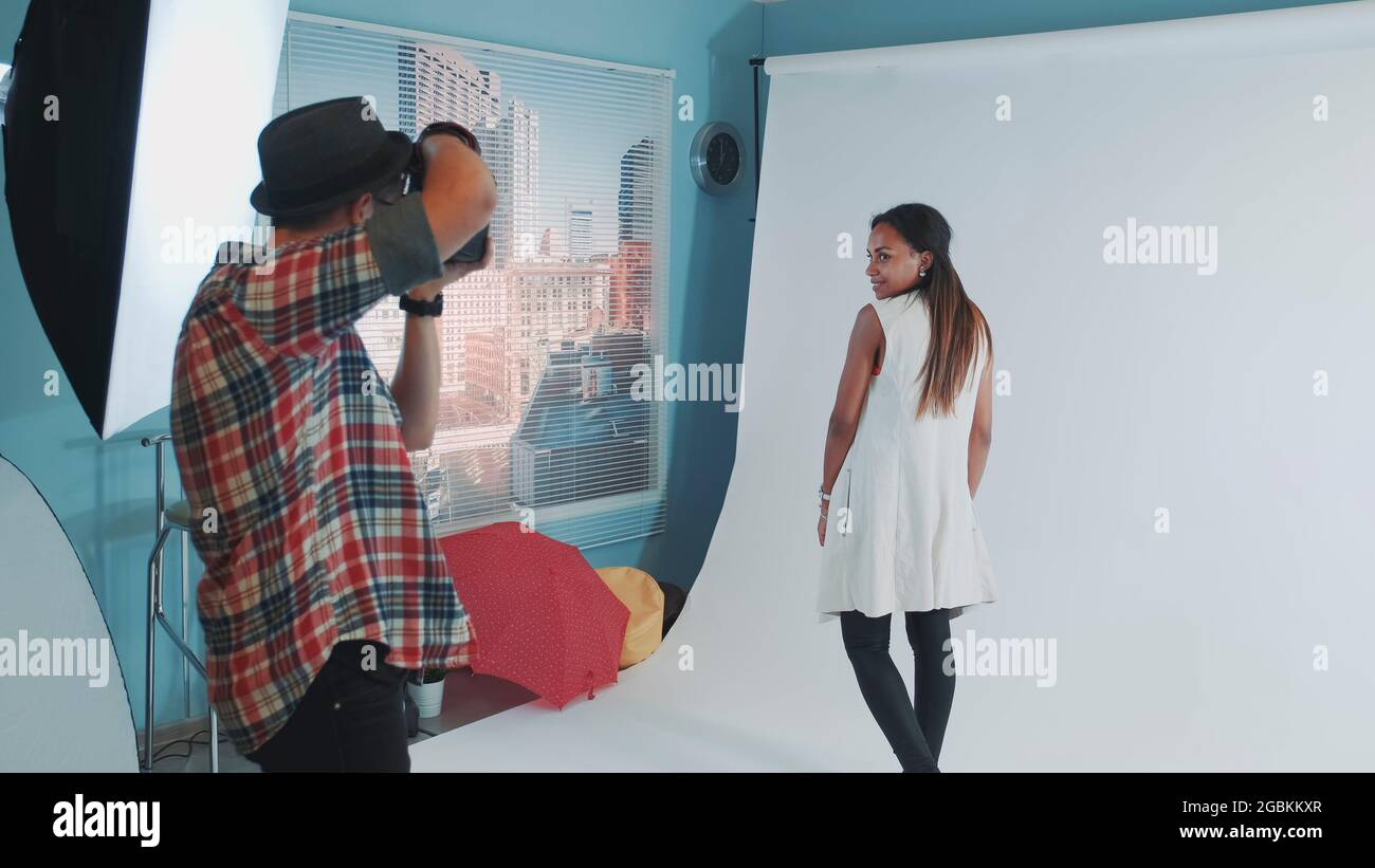 Backstage of photo shoot: multiracial young woman posing for fashion ...