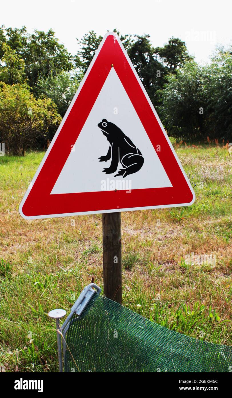 Frog zone sign in the forest Stock Photo - Alamy