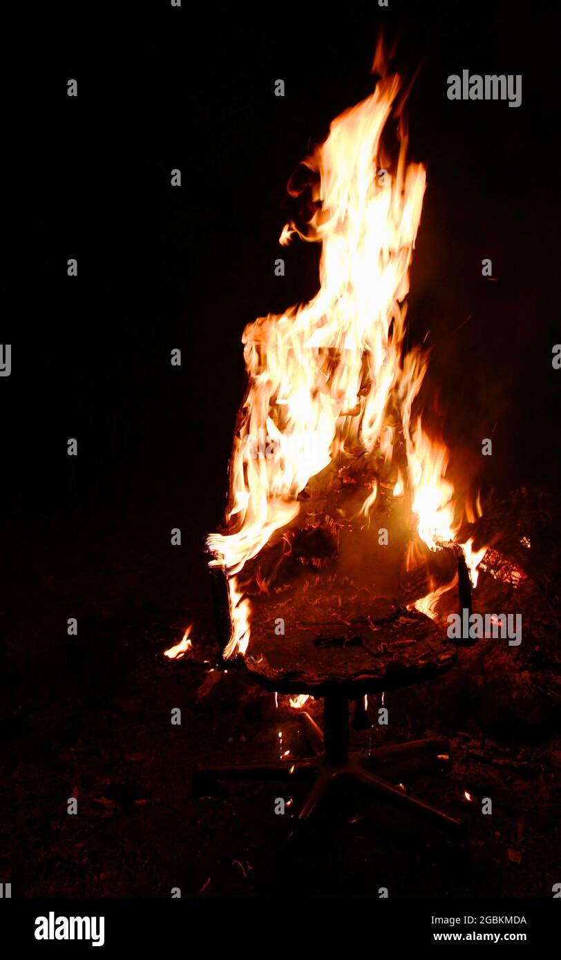 Bright flames of fire of a burning chair at night Stock Photo - Alamy