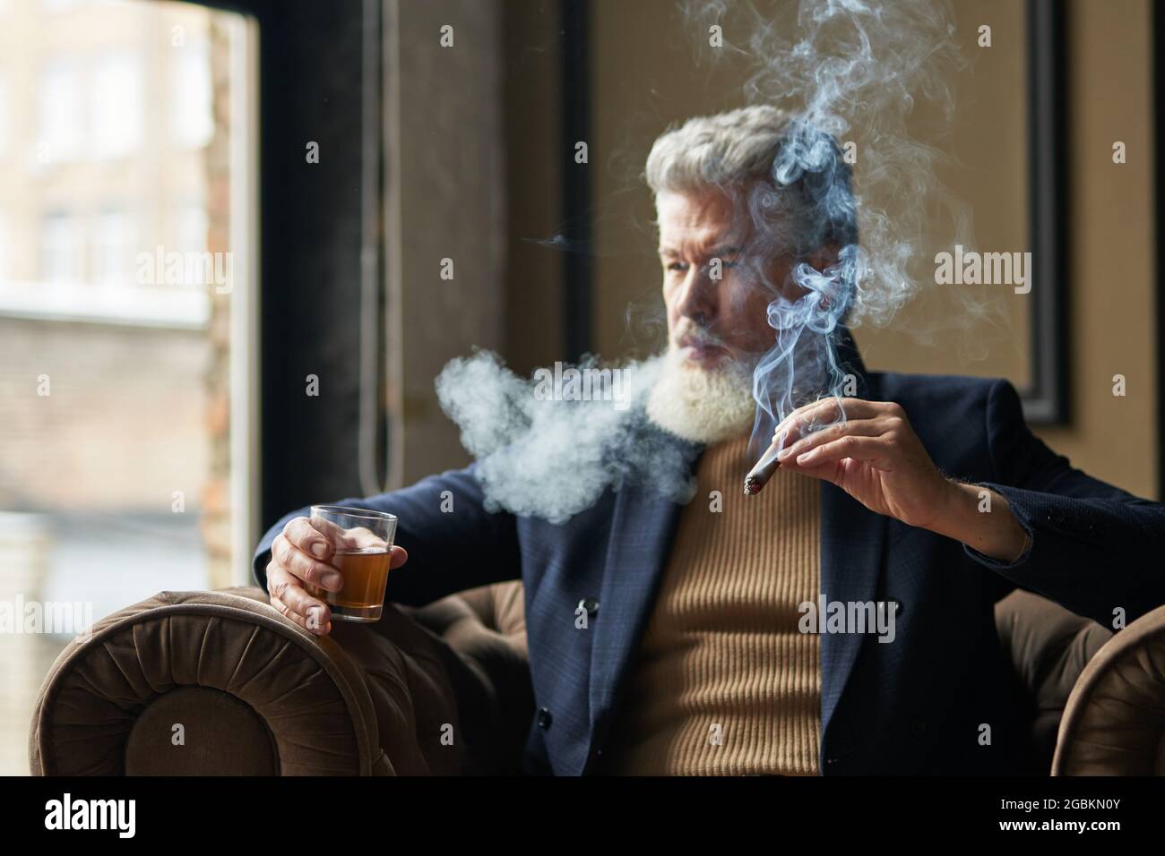 Man chair cigar drink hi-res stock photography and images - Alamy