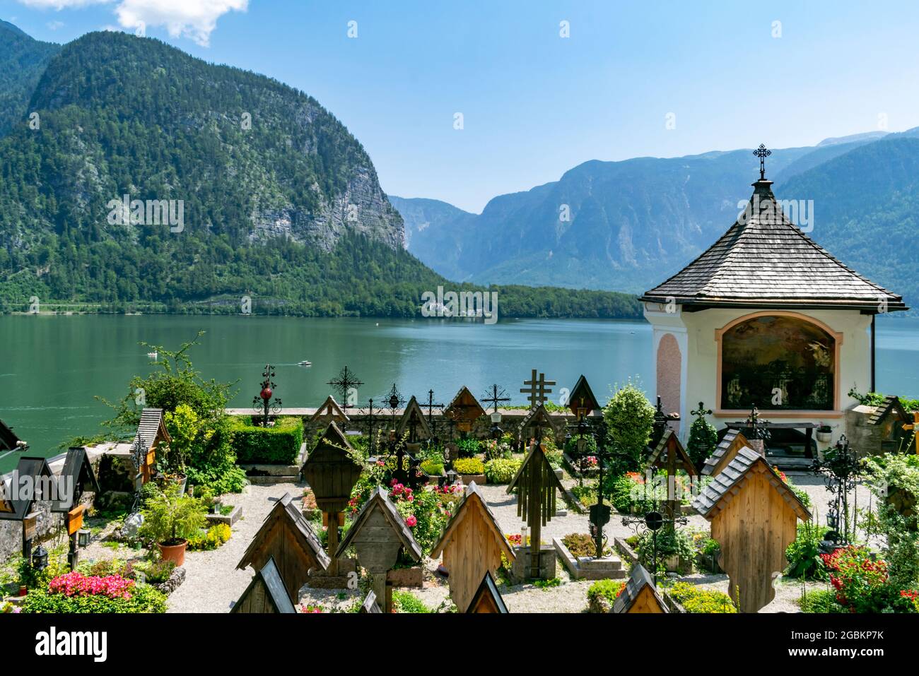 Cemetery of Hallstatt, Austria in front of Gosauseen lake and high ...