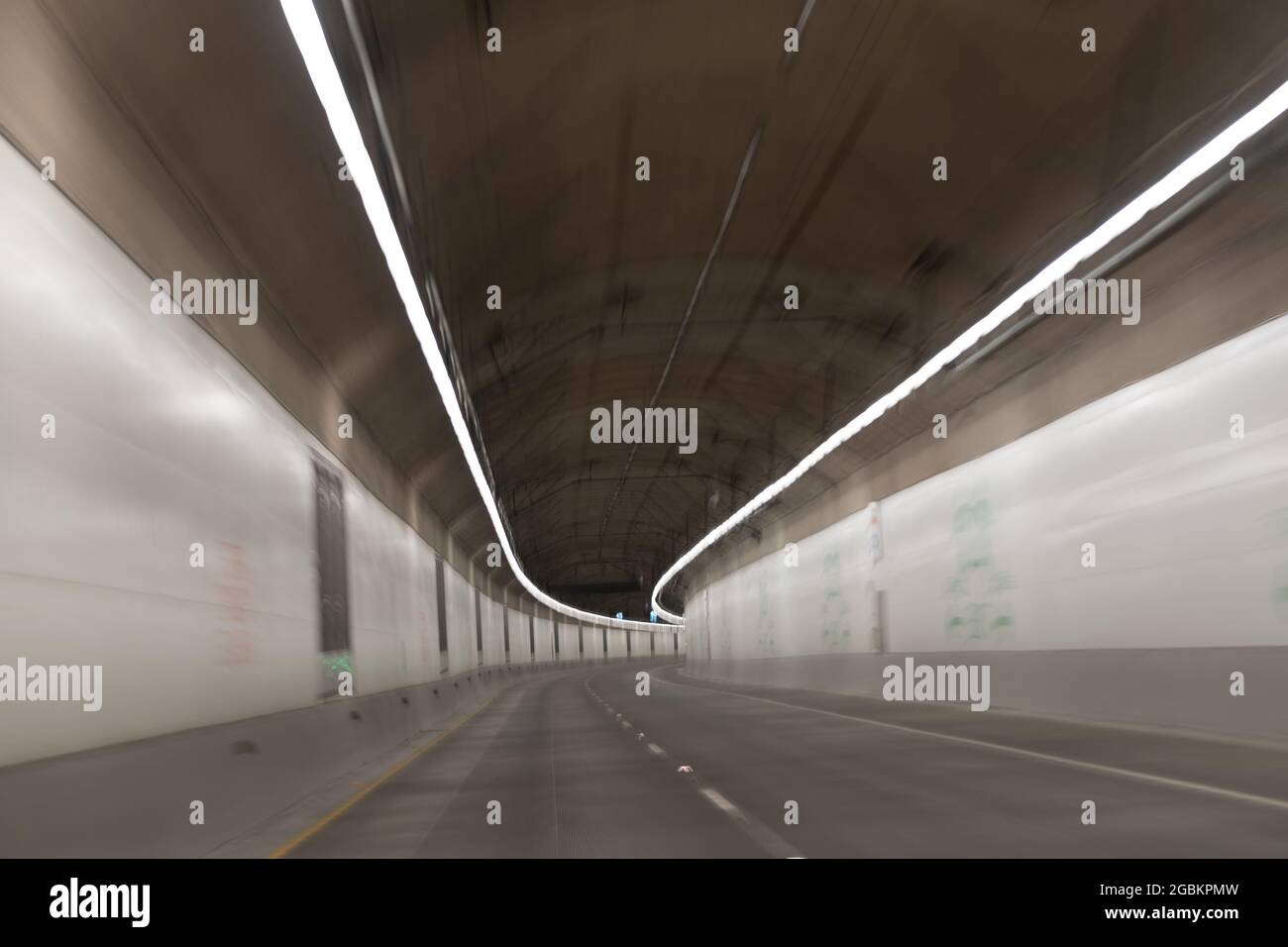 modern underground tunnel with gray road tunnel of motion car, road ...