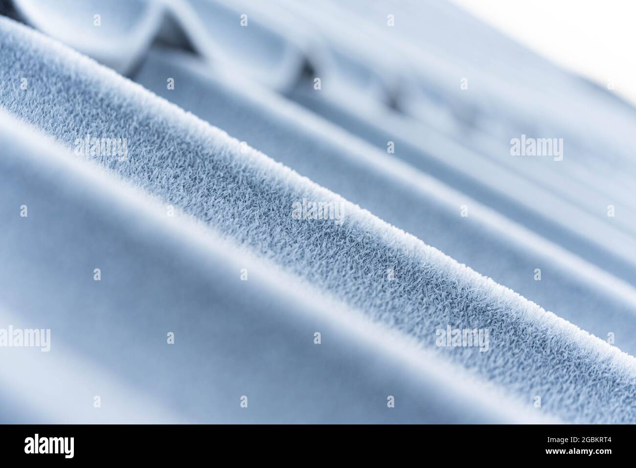 Frost on the roof, corrugated sheet covered with white ice crystals ...