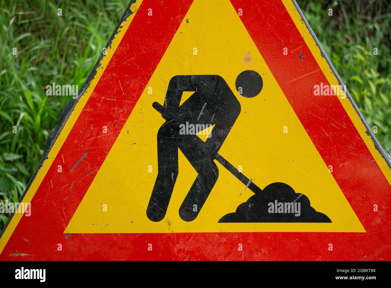 Yellow triangle street sign indication an ongoing construction work ...