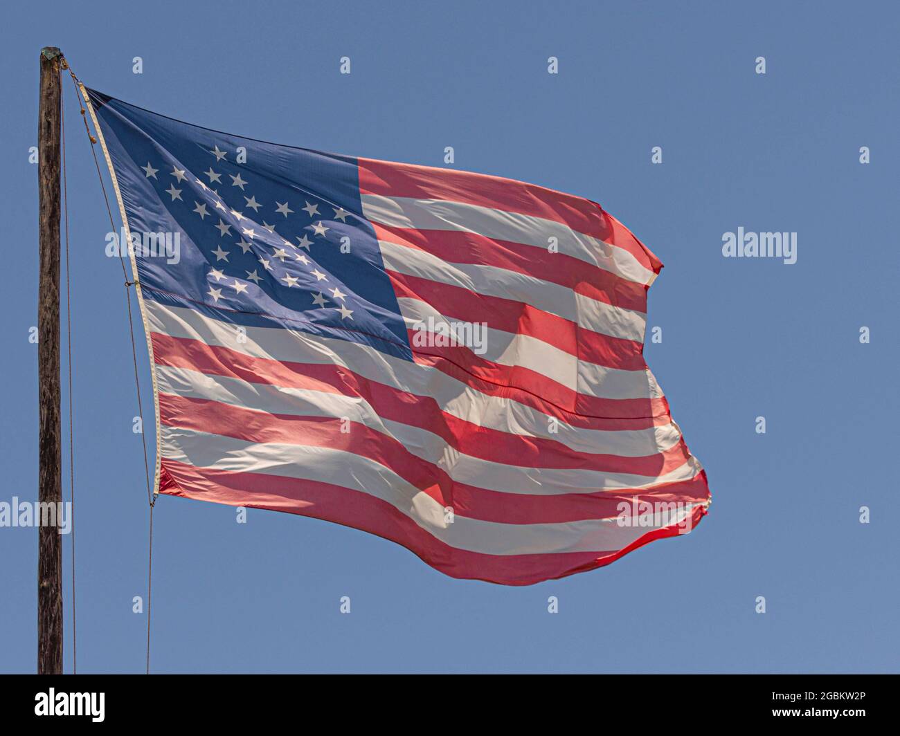 Historic vintage flag of the USA with 38 stars arranged in the shape of ...