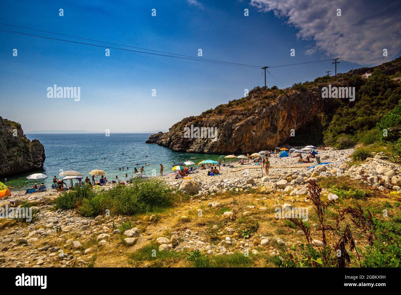 Panoramic view of Foneas beach overcrowded with tourists and swimmers ...
