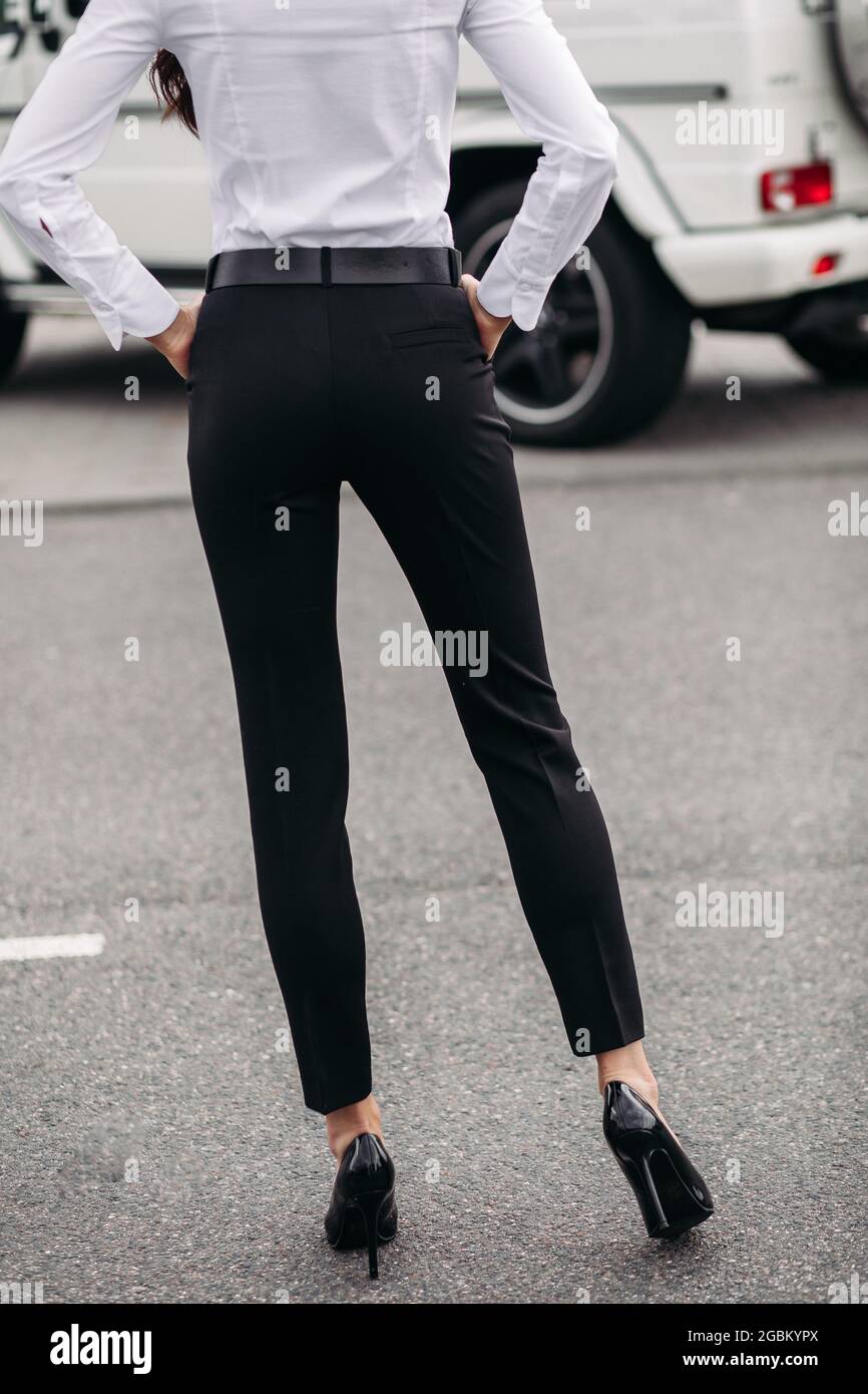 Back view of woman in formal black trousers Stock Photo - Alamy