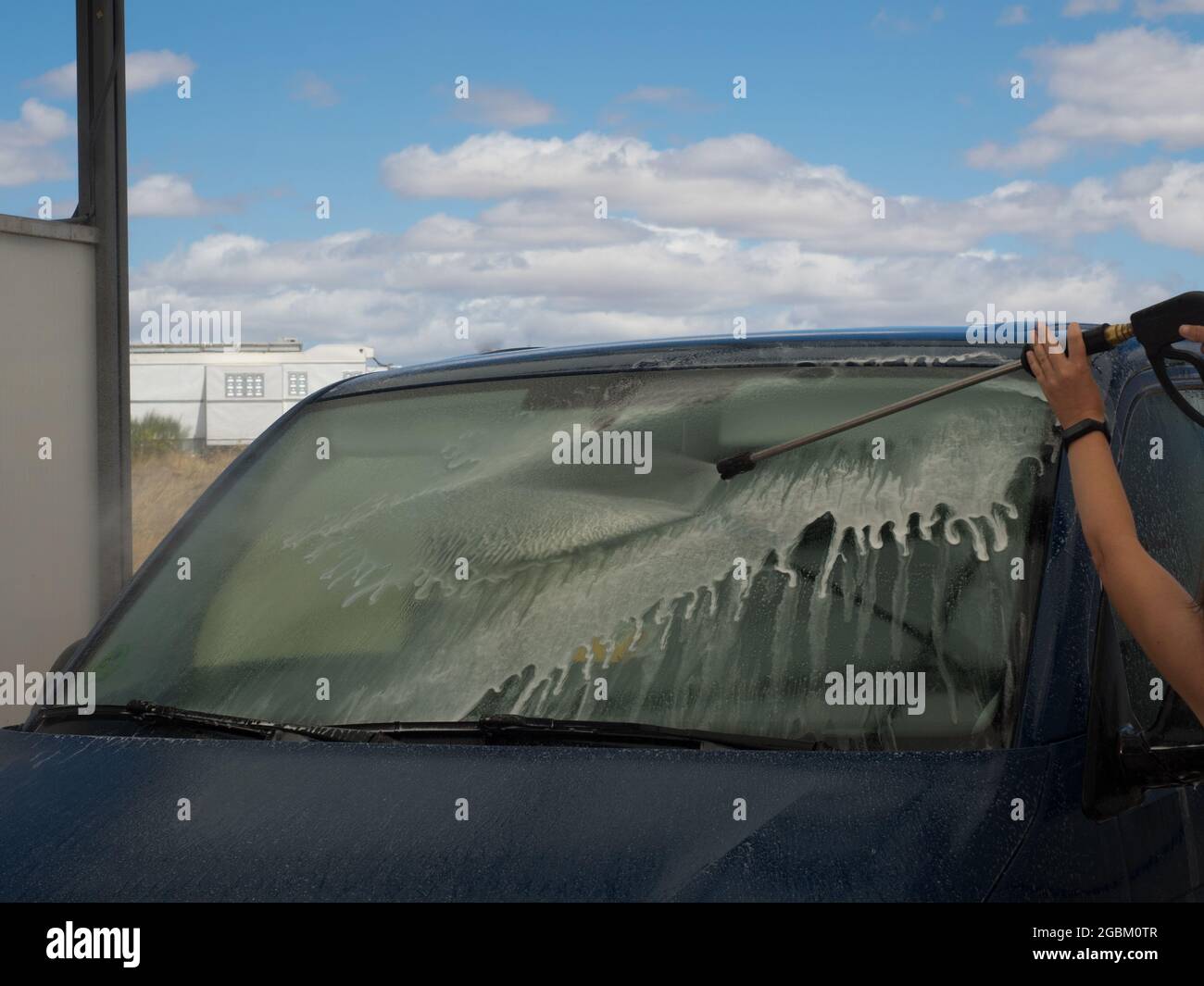 self-washing of the front window of a van Stock Photo - Alamy