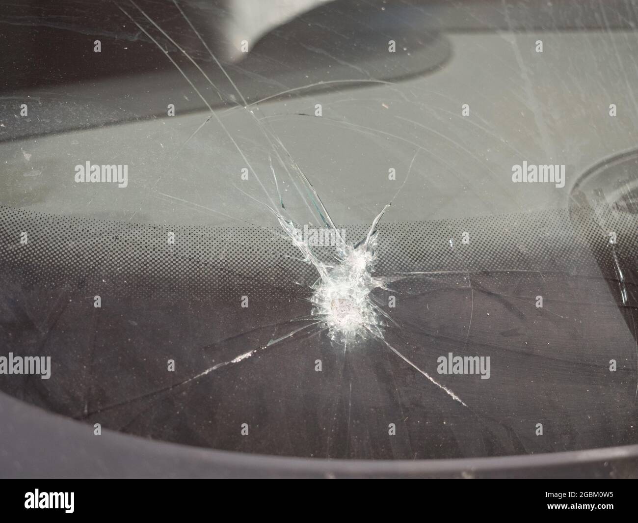 car front window broken with a stone Stock Photo - Alamy