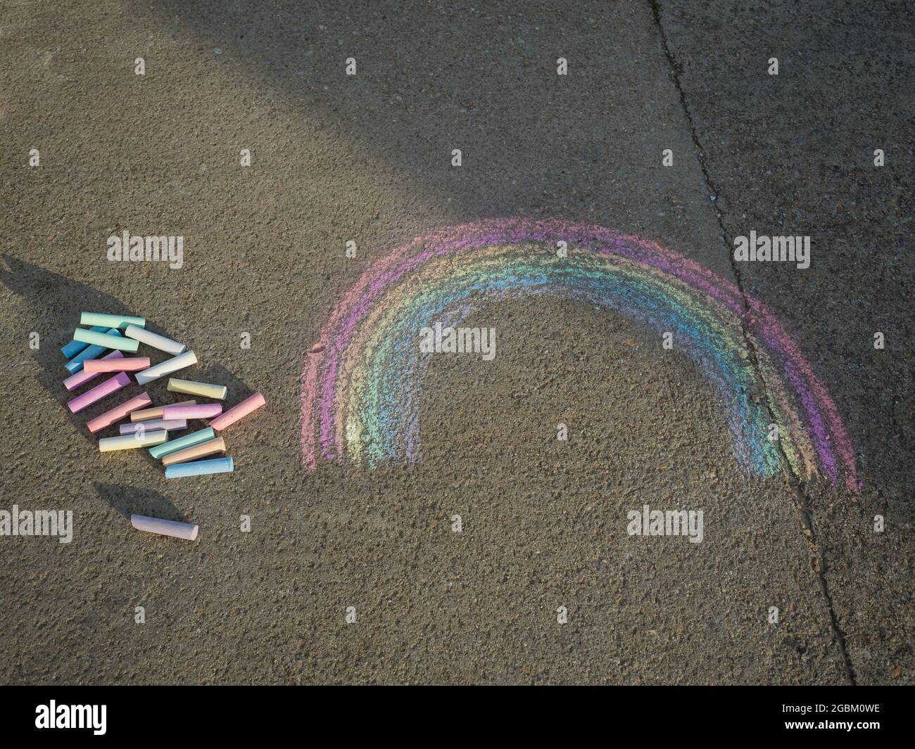 A drawing in the pavement with different chalks Stock Photo - Alamy